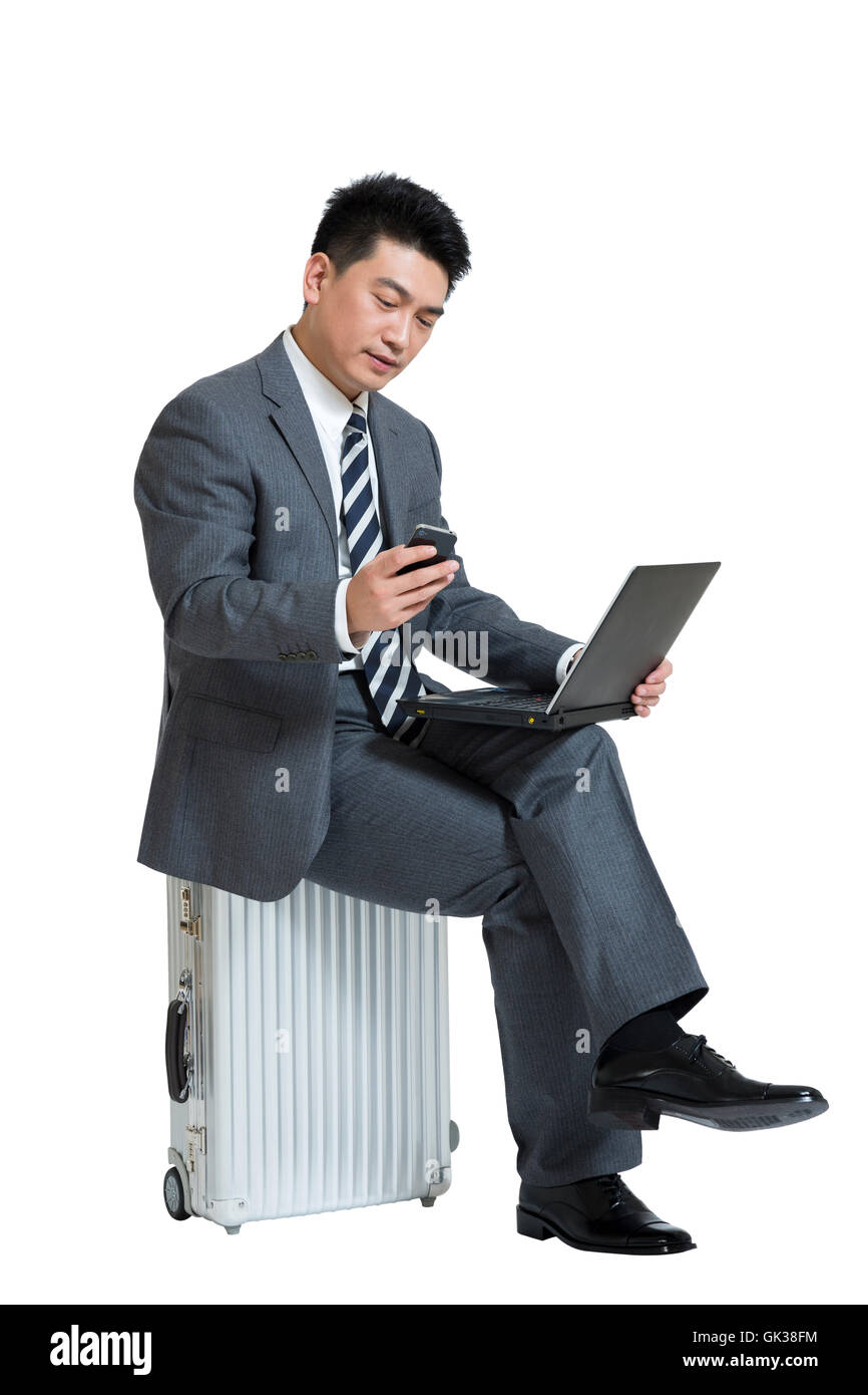 Studio shot business men using laptop Stock Photo - Alamy