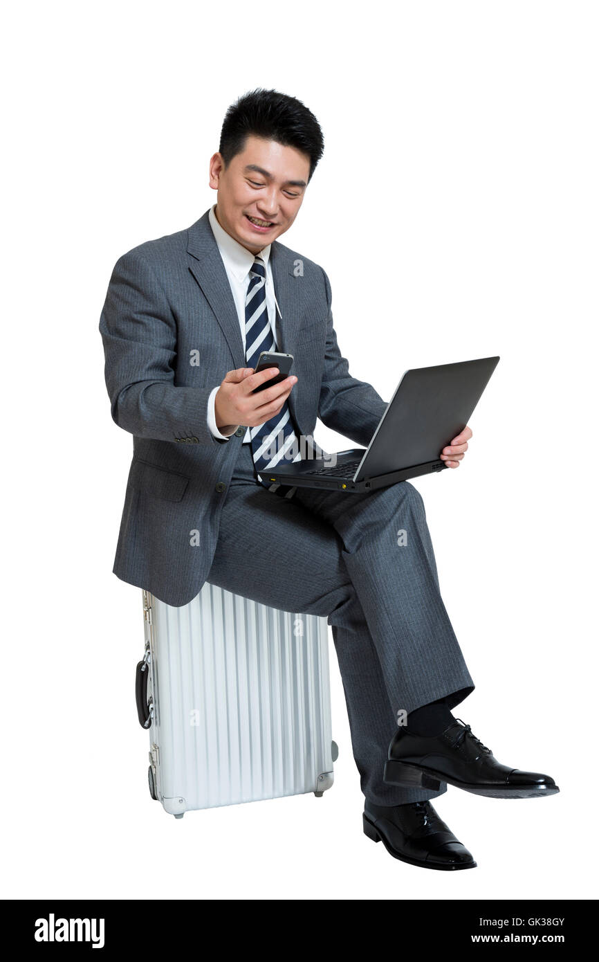 Studio shot business men using laptop Stock Photo - Alamy