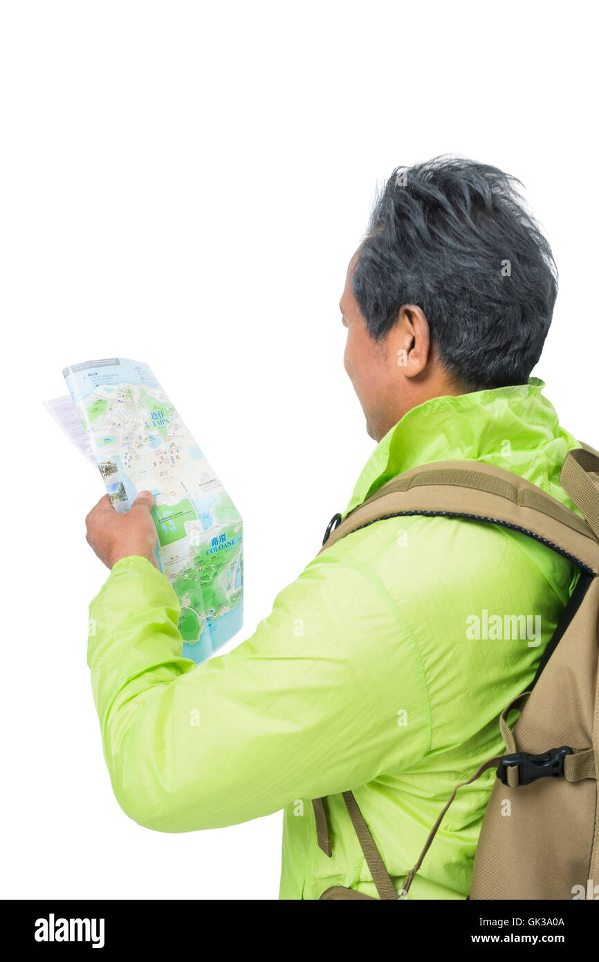Happy elderly look at the map Stock Photo - Alamy
