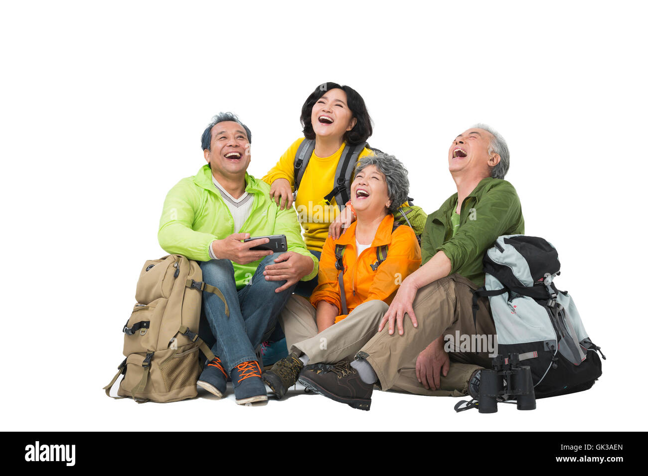 Four elderly people sitting together rest Stock Photo - Alamy