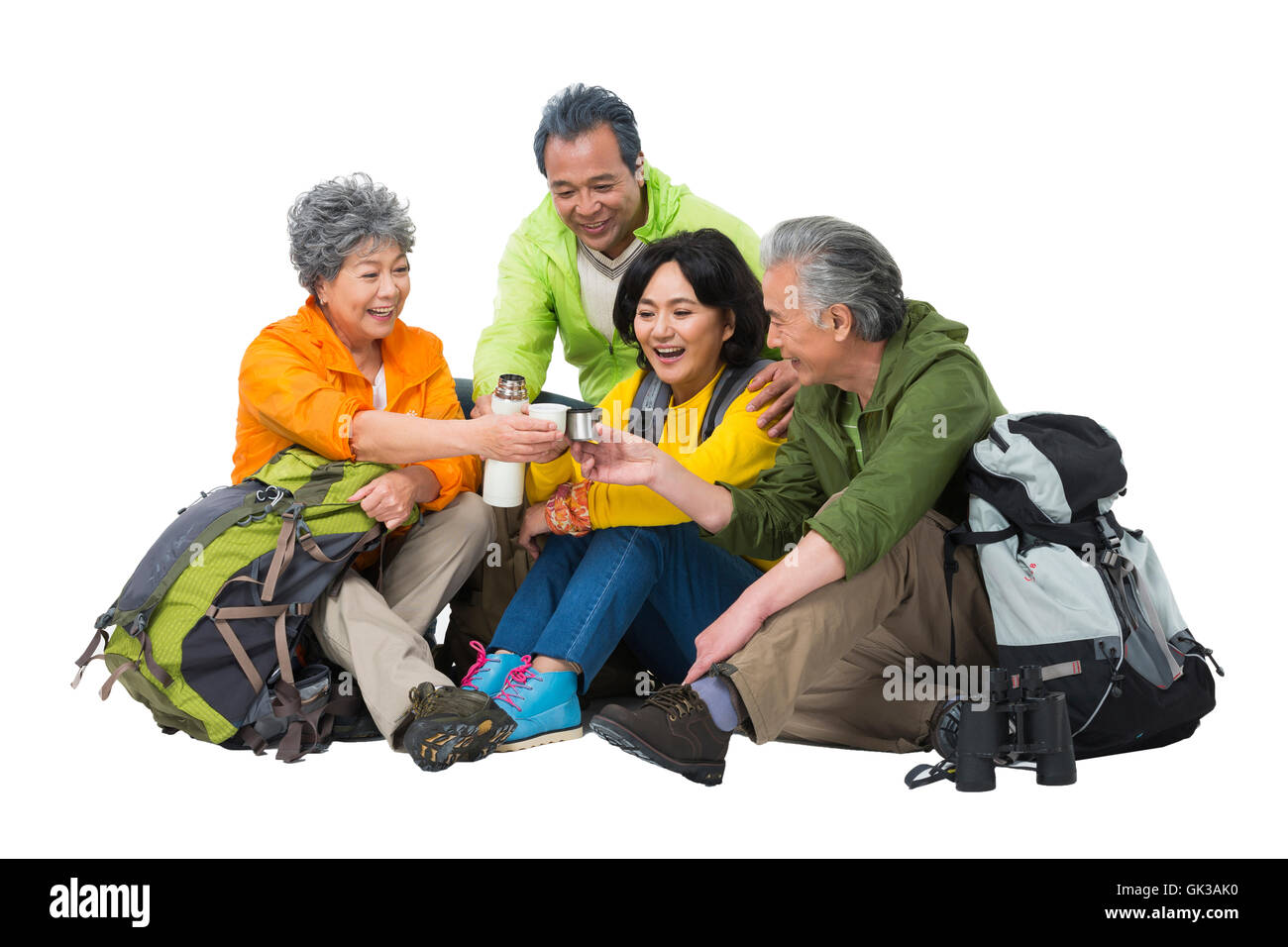 Four elderly people sitting together rest Stock Photo - Alamy