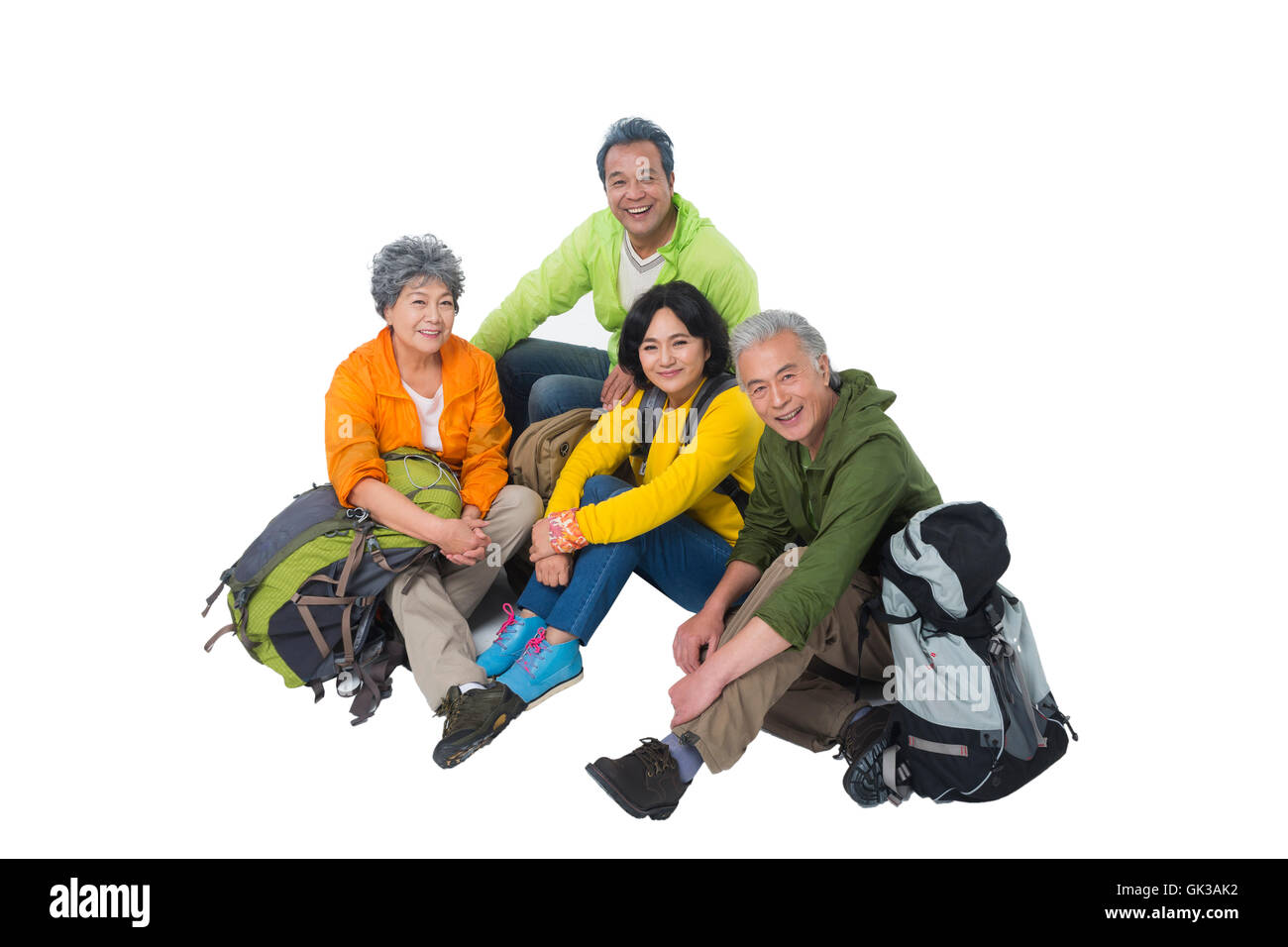 Four elderly people sitting together rest Stock Photo - Alamy