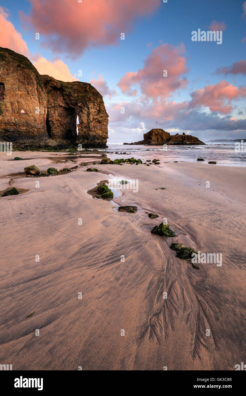 The natural sea arch on Perranporth beach in Cornwall, captured at ...