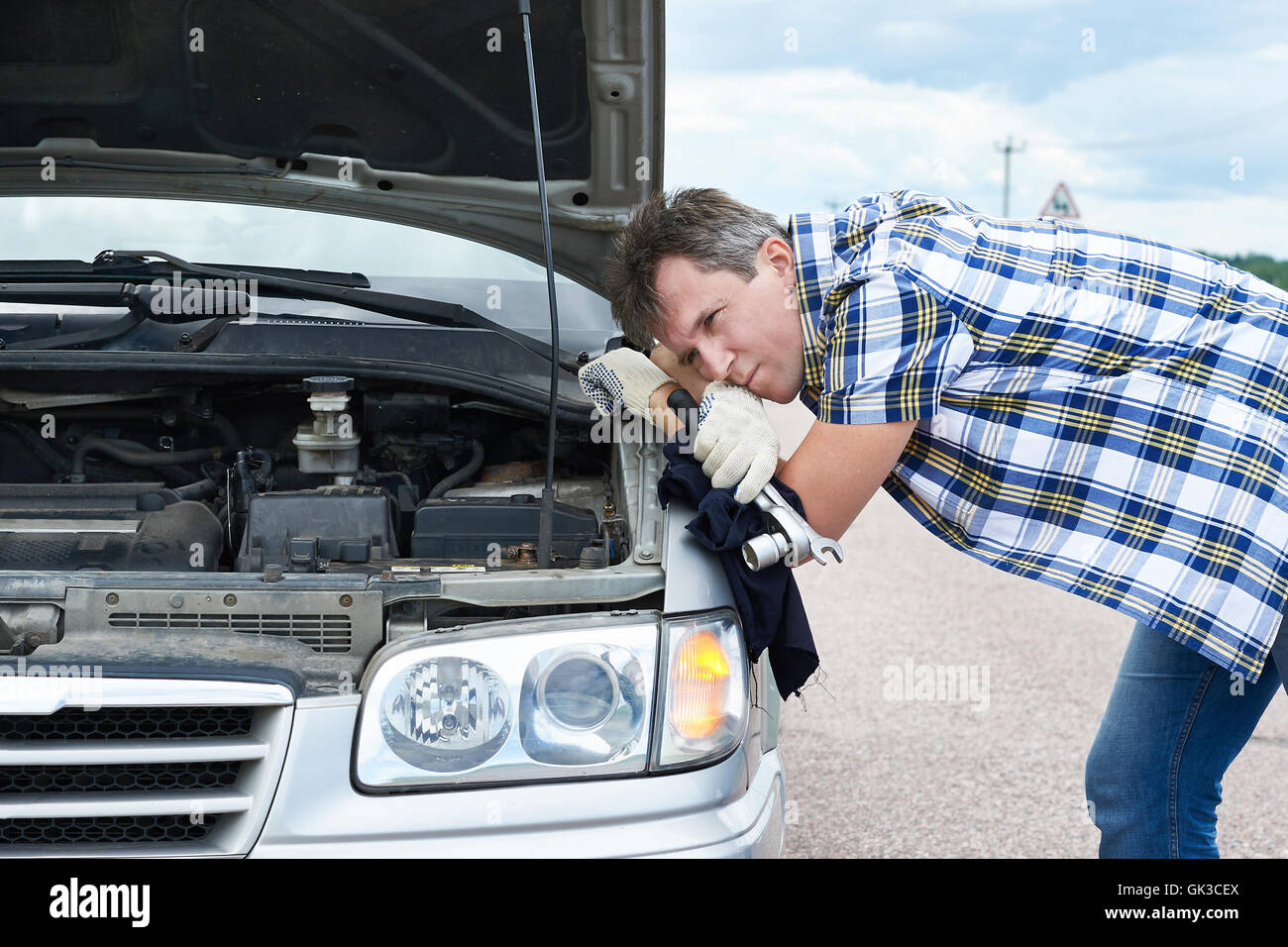 Man with tools near his broken car Stock Photo - Alamy