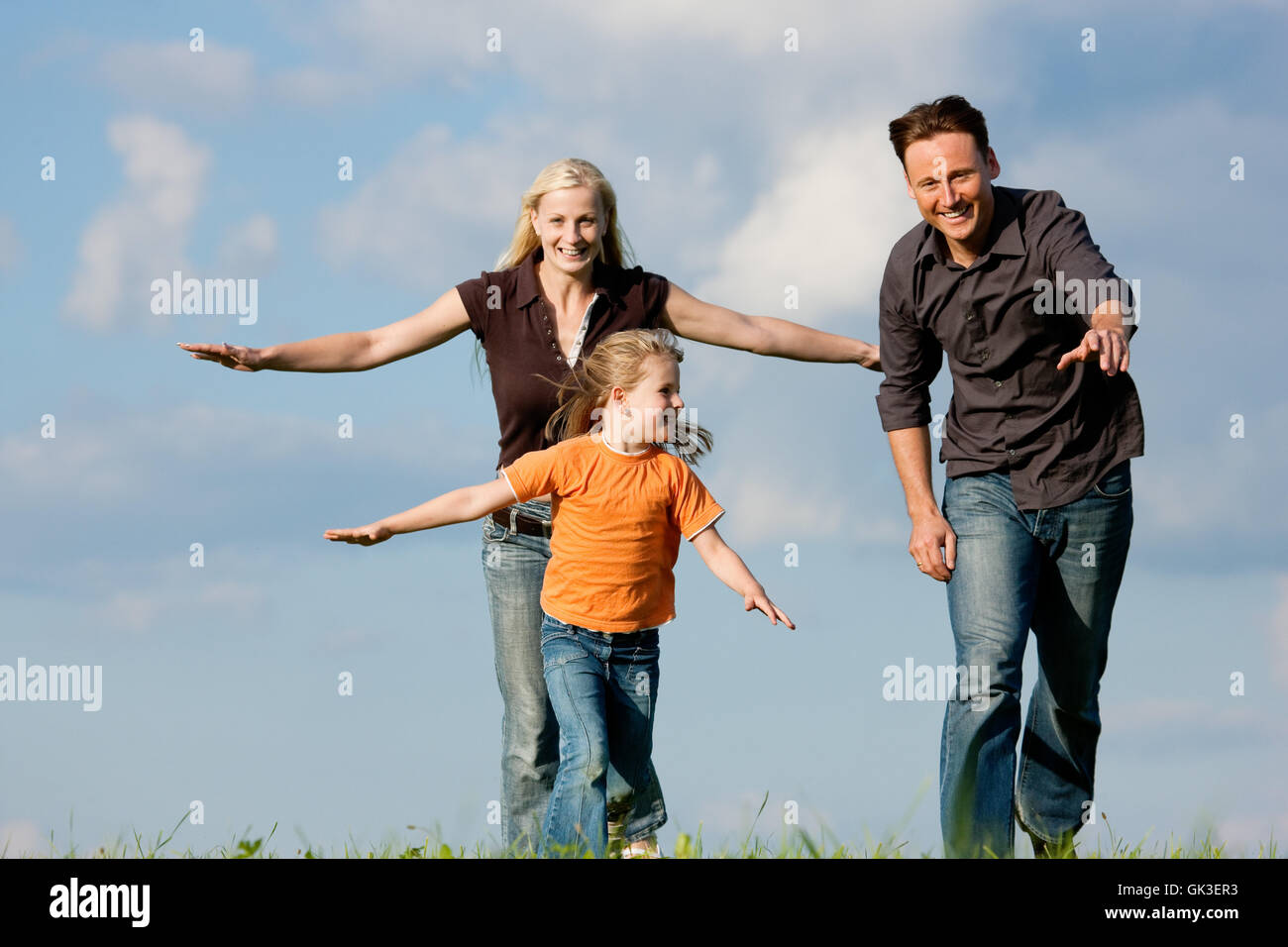 family taking a walk in action Stock Photo - Alamy