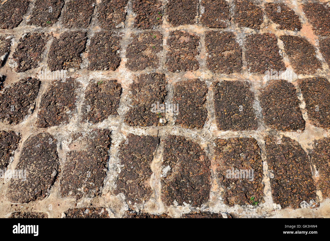 Ancient floor laterite stone background Stock Photo - Alamy