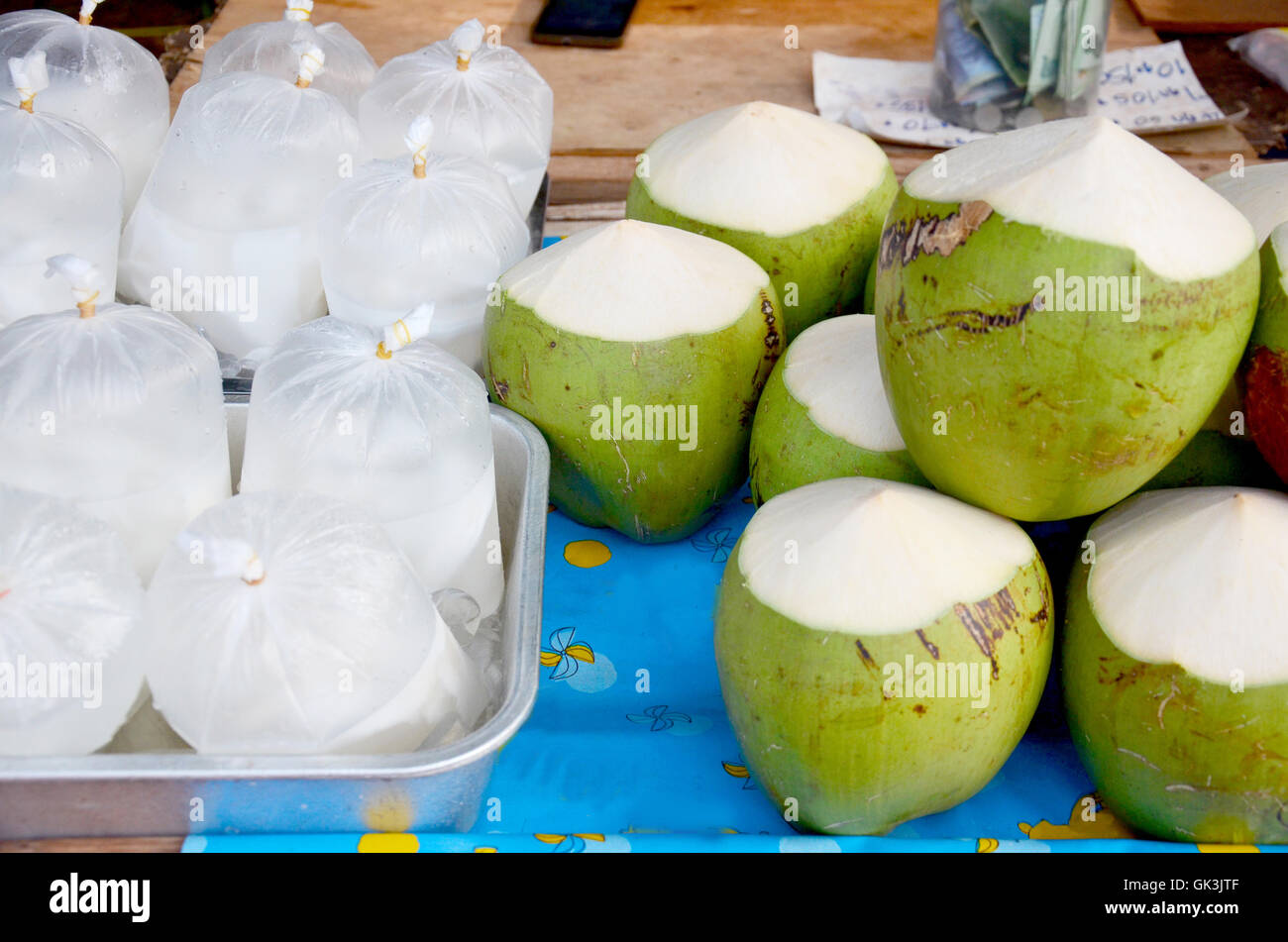 Coconut juice and coconut water packing thai style for sale at local ...