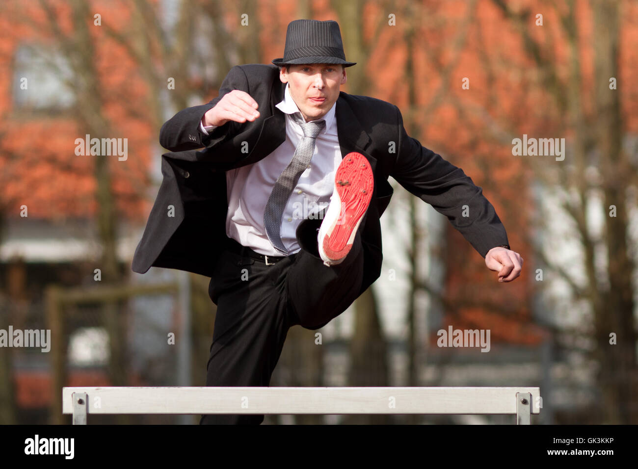Businessman jumping hurdles hi-res stock photography and images - Alamy
