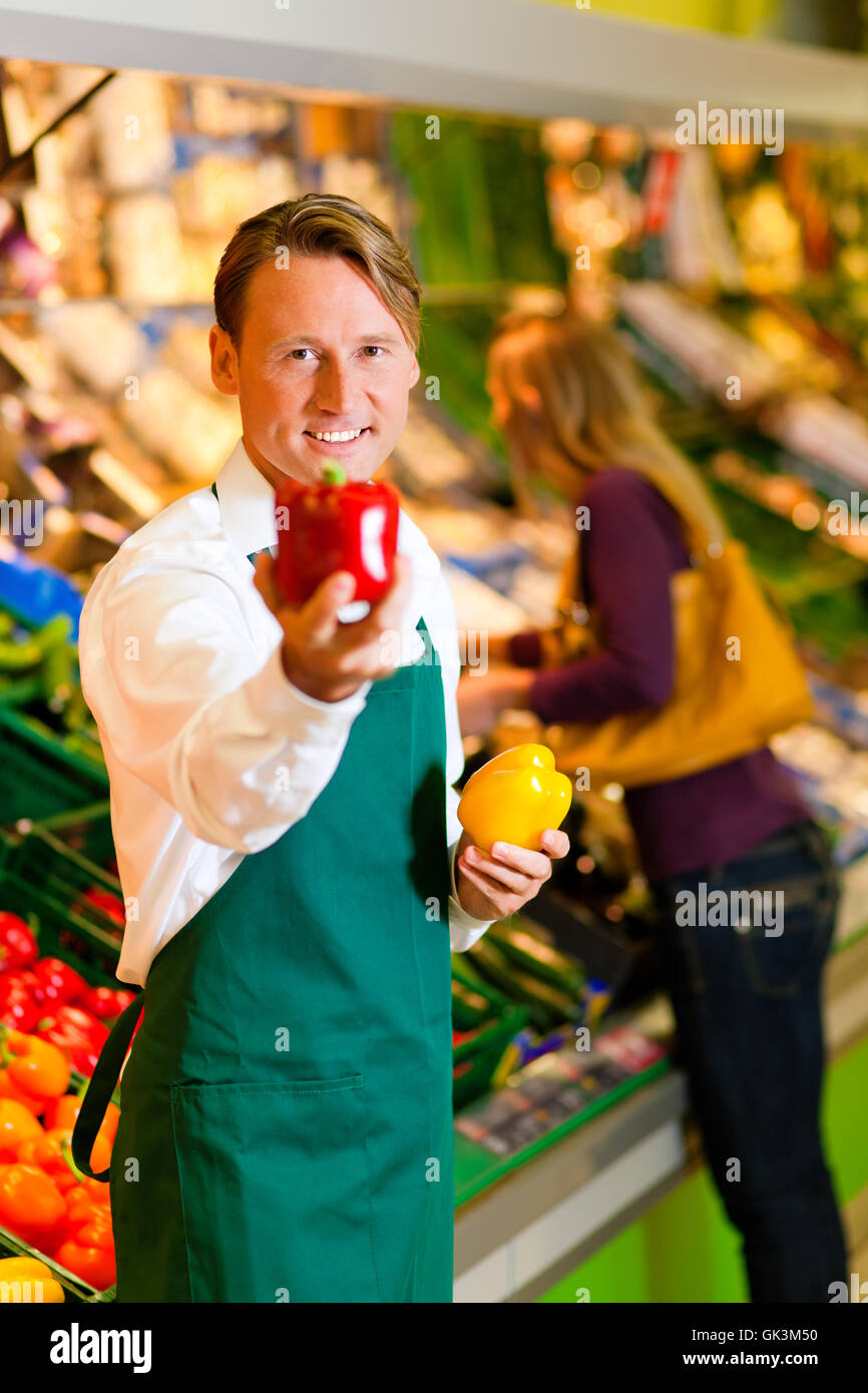 man in supermarket as seller Stock Photo - Alamy