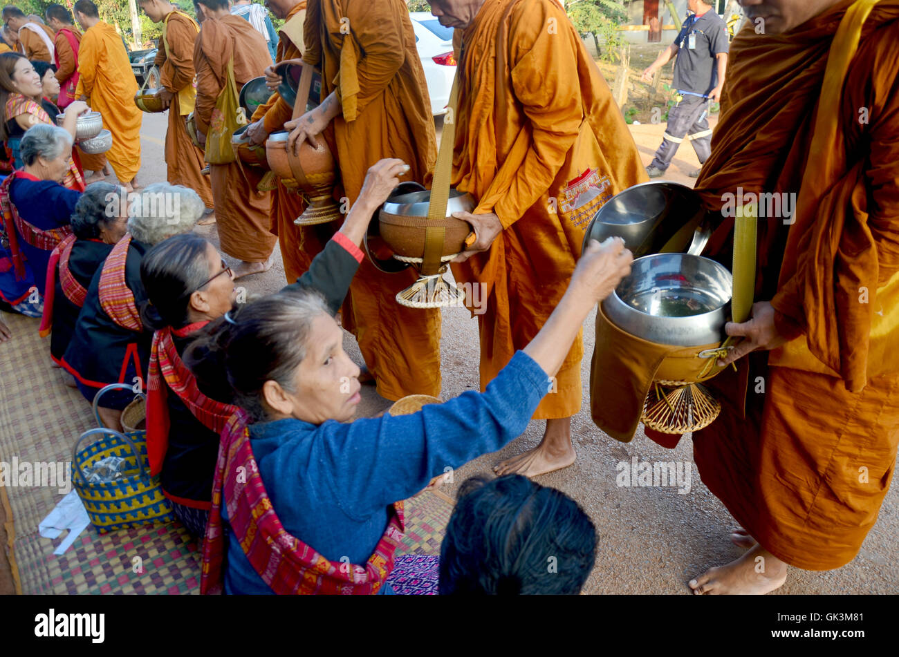 Traditional of almsgiving with sticky rice by Monks procession walk on ...