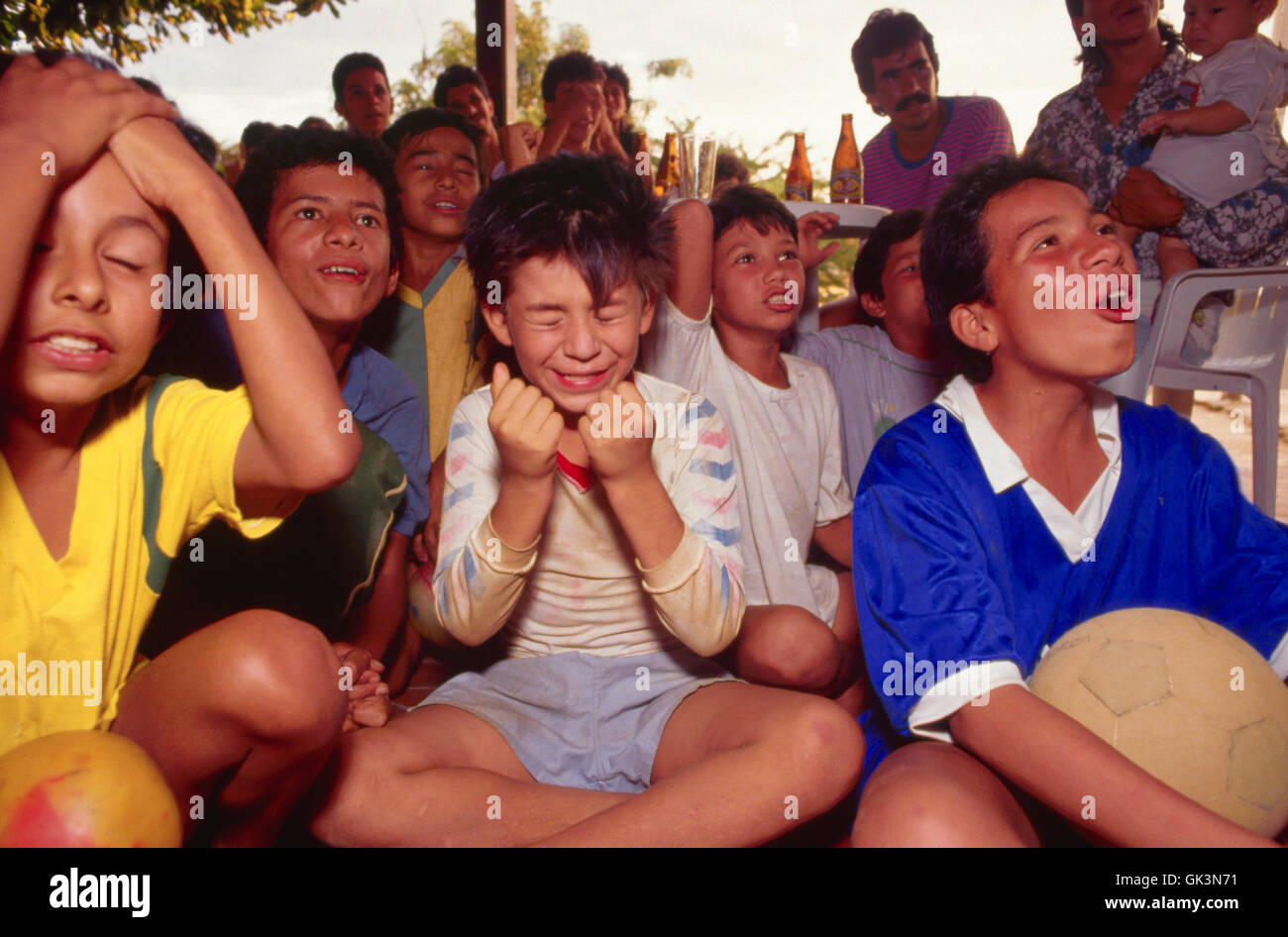 ca. 1980-1995, Colombia --- Boys show their disappointment as they ...