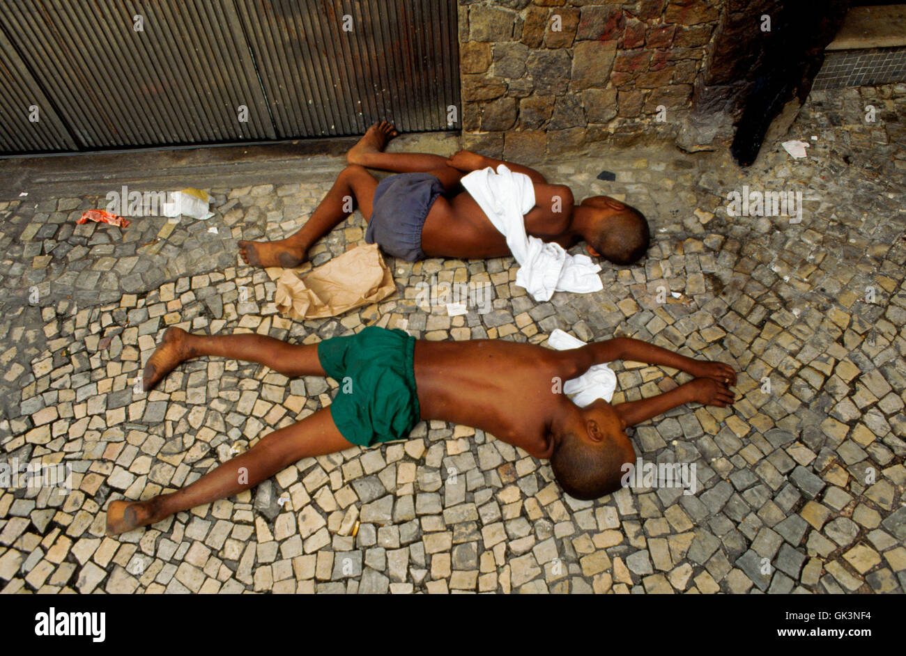 ca. 1985-1995, Rio de Janeiro, Brazil --- Street children sleep on the ...