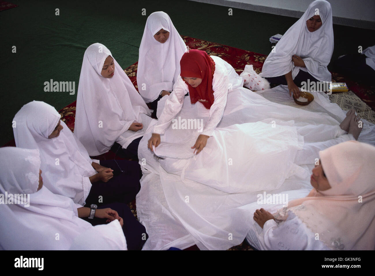 ca. 1990 - 2000 --- Girls Learning how to Perform a Moslem Burial ...