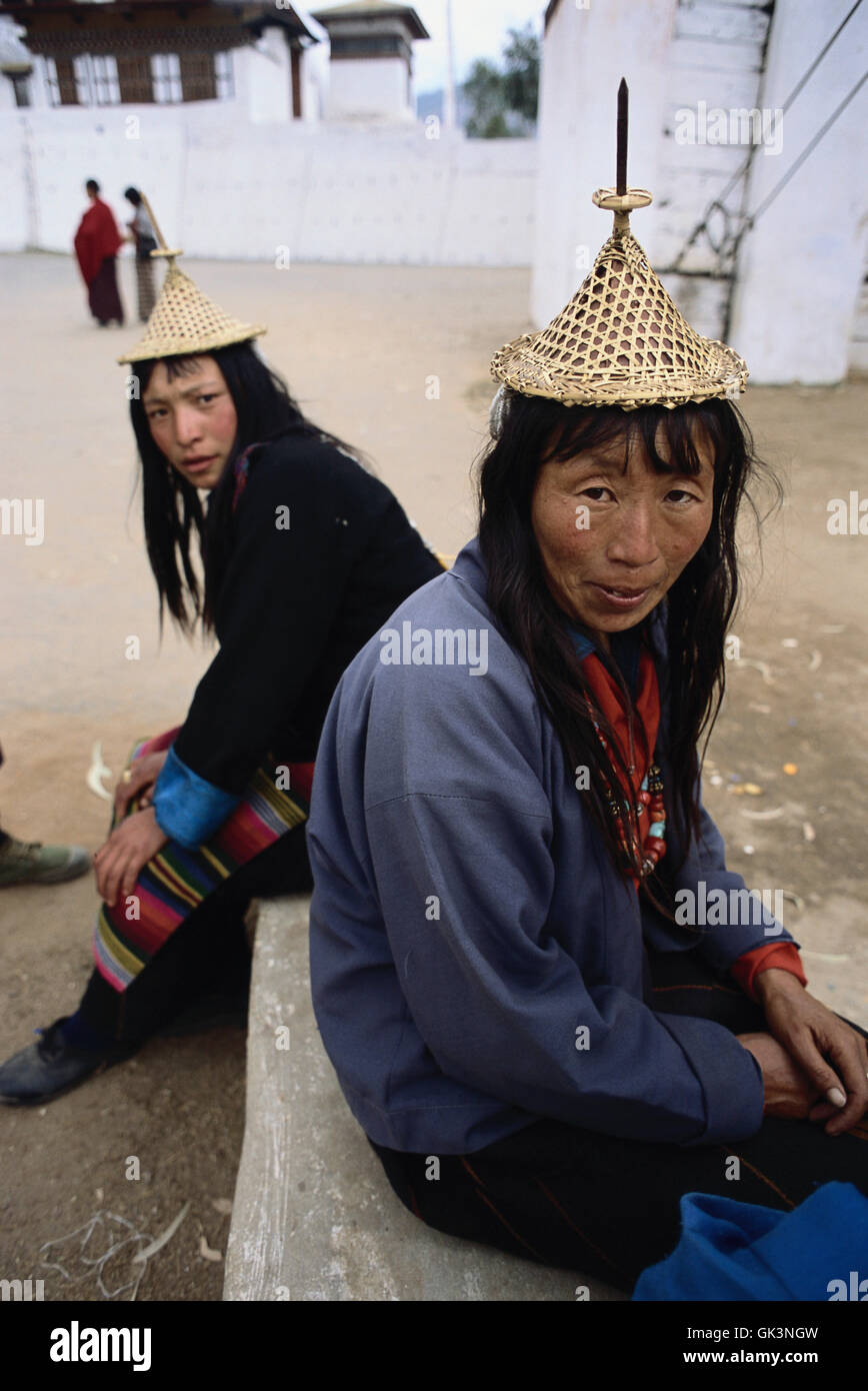 ca. 2000, Punakha, Bhutan --- Layap Tribeswomen Wearing Bamboo Hats ...