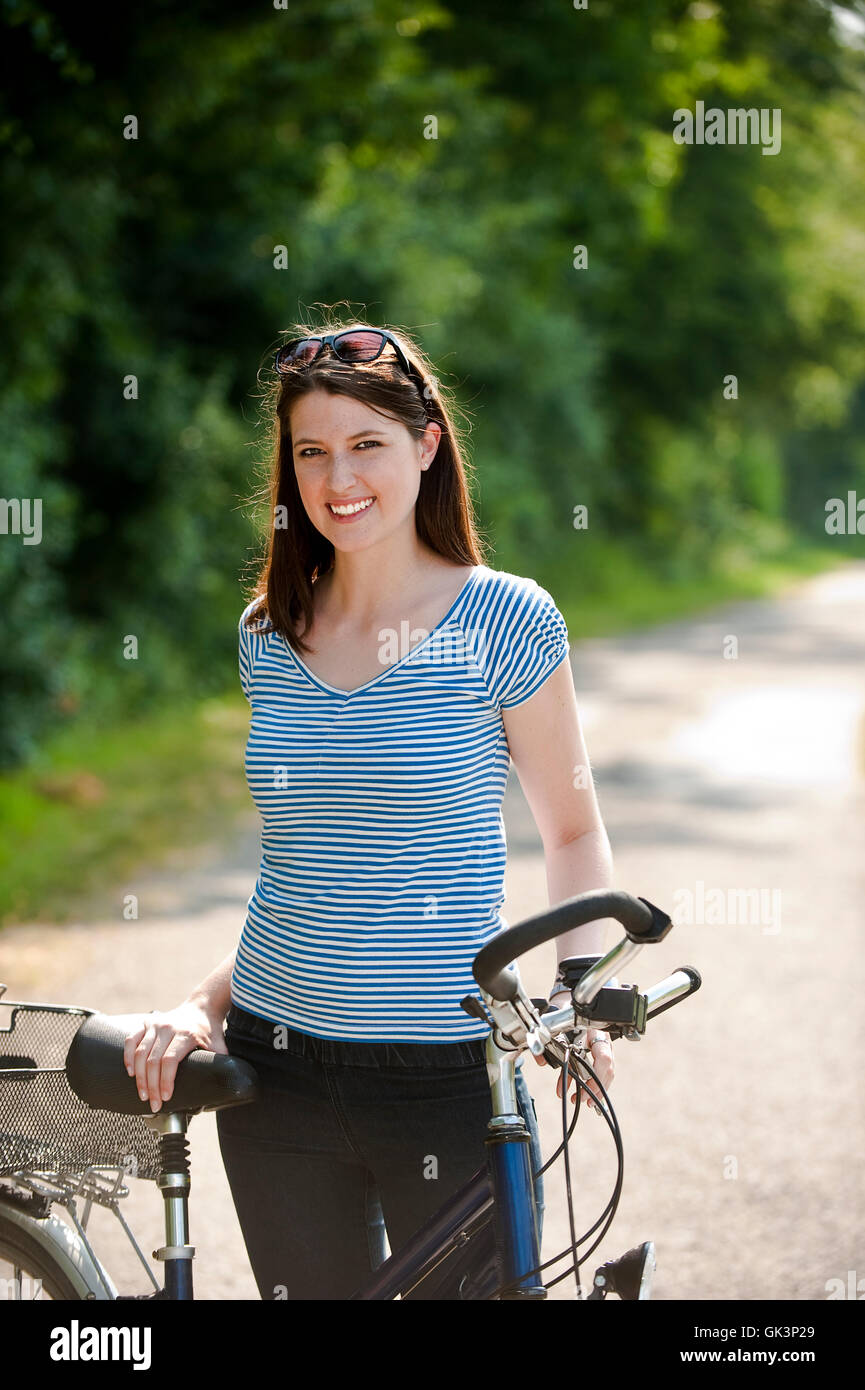 young woman riding a bike Stock Photo - Alamy