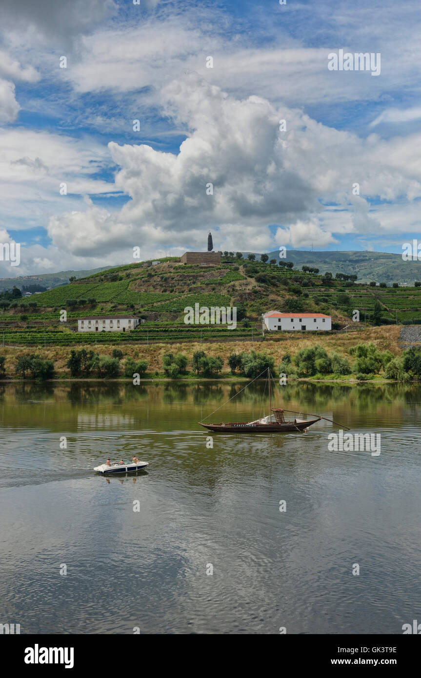 A statue of the Sandeman port man stands on the top of a hill outside ...