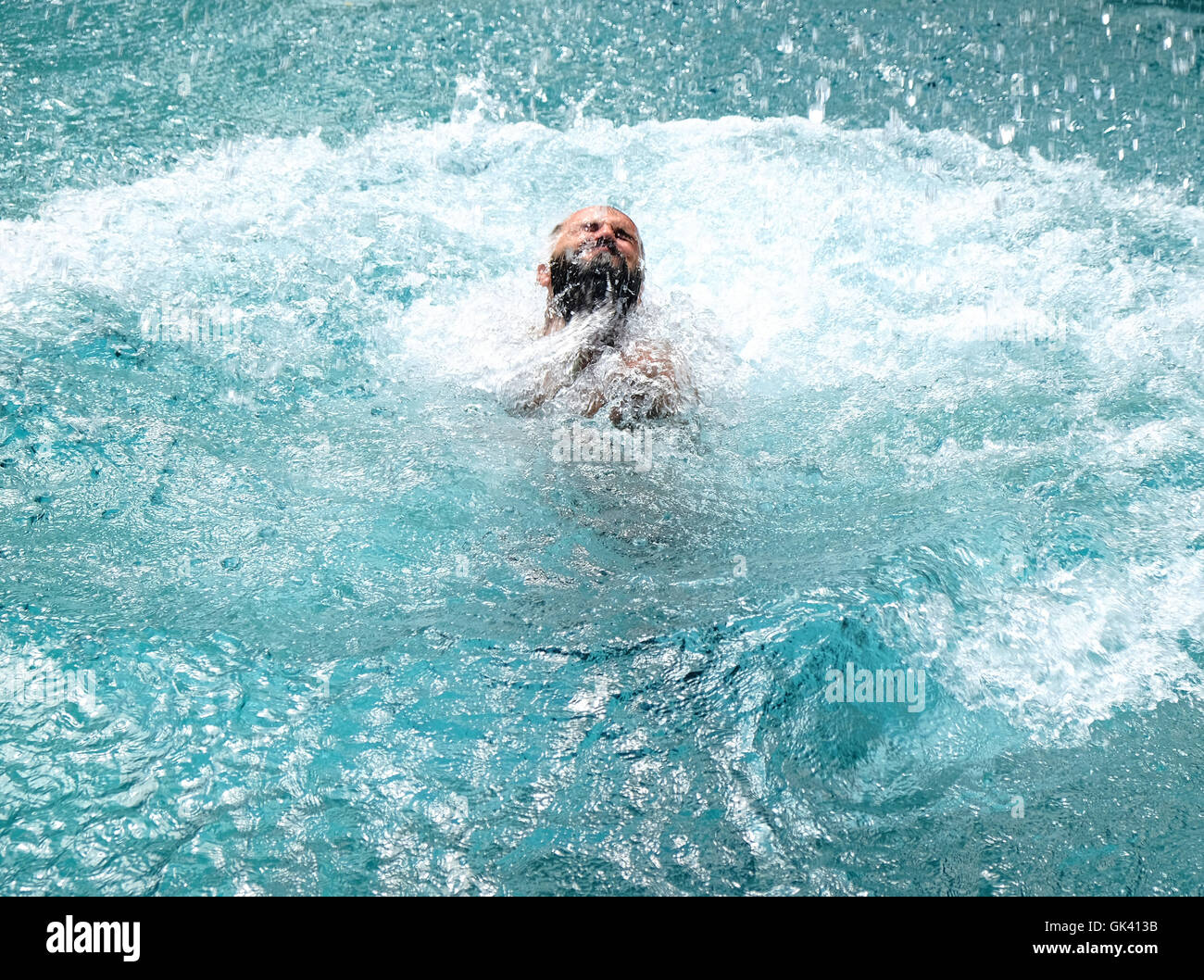 Man coming out of the water in a swimming pool Stock Photo - Alamy