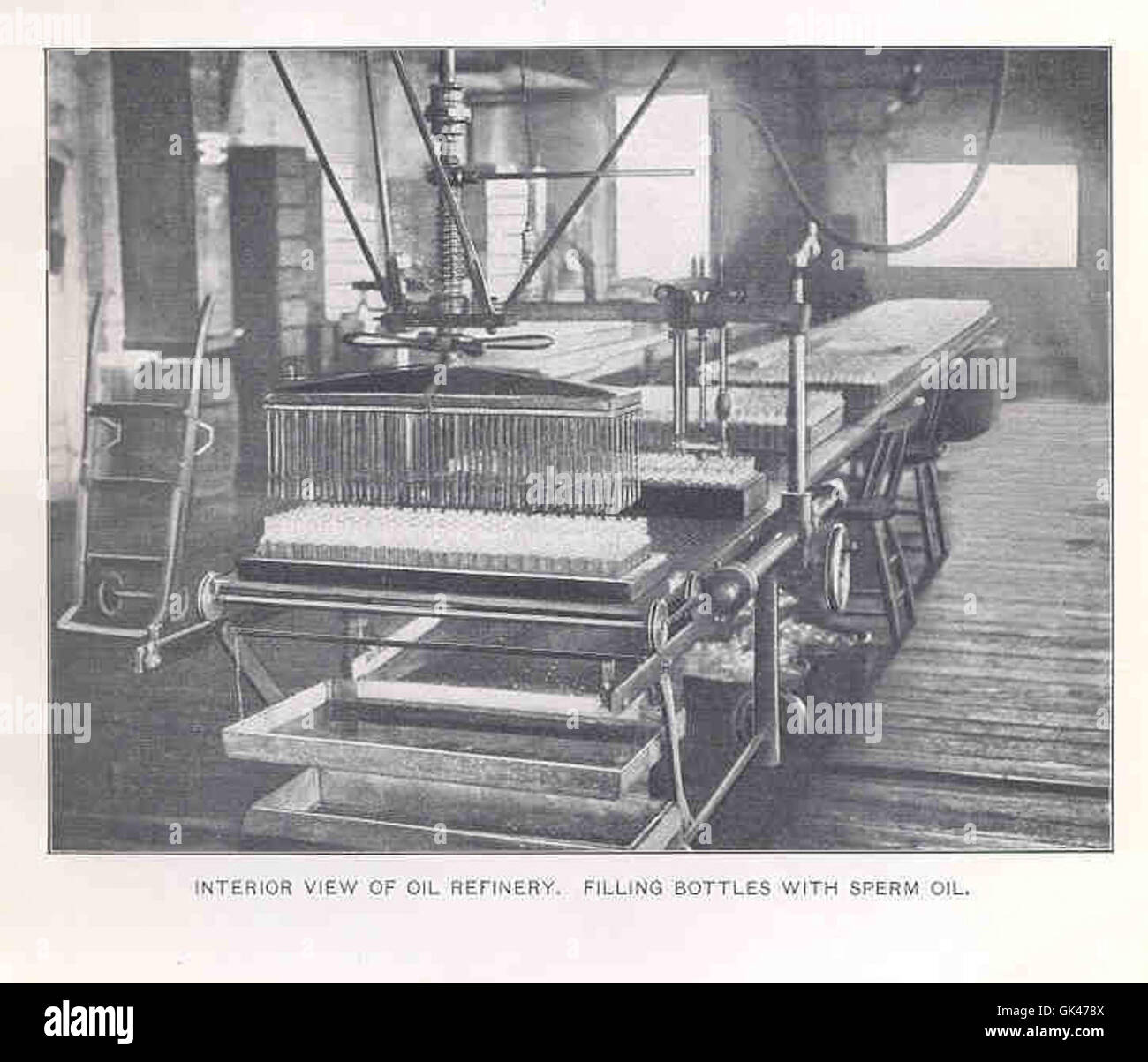 An interior view of an oil refinery, showing the machinery and systems ...