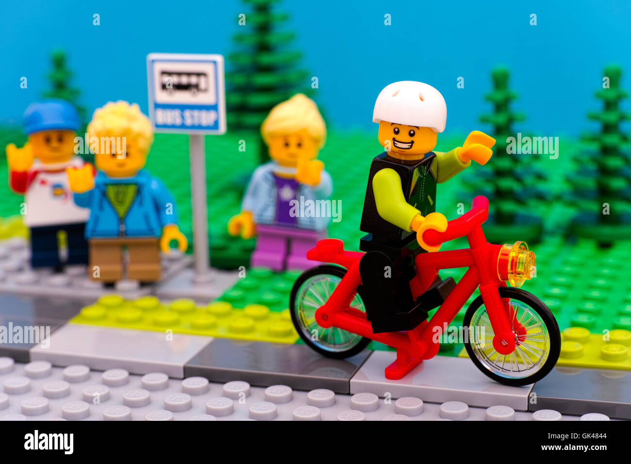 Man riding bike waving hi-res stock photography and images - Alamy