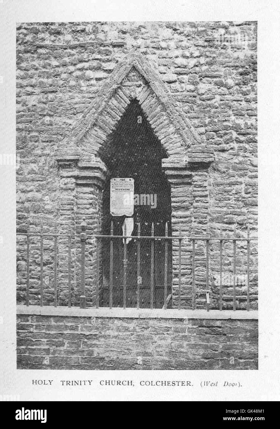 The Holy Trinity Church in Colchester is shown with its west door. This ...