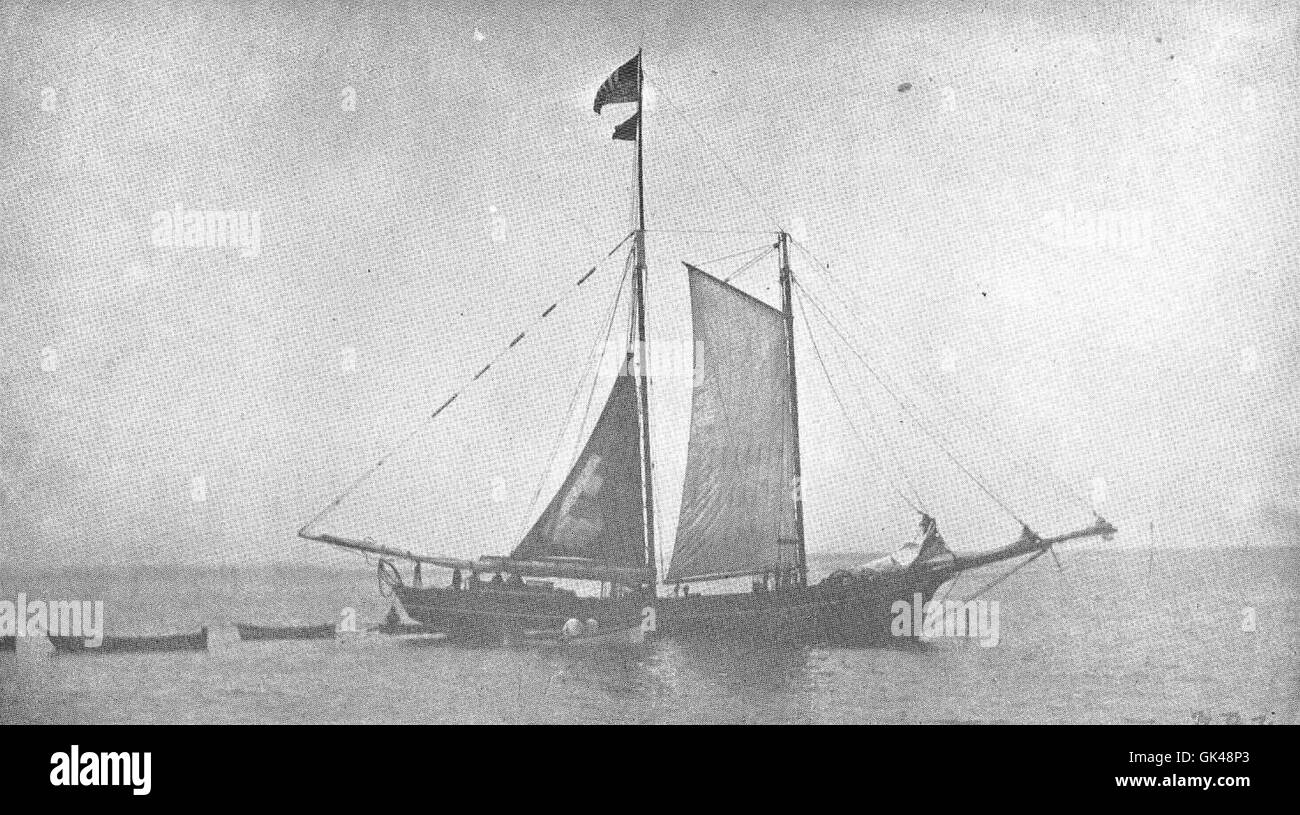 The *American Sealing Schooner Columbia*, shown alongside canoes, was ...