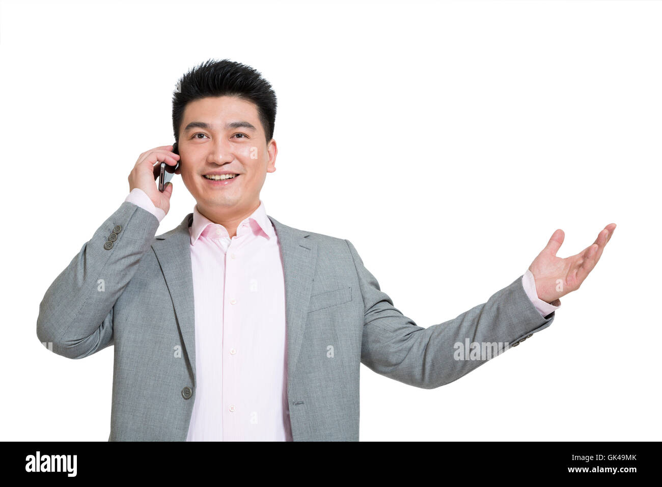 Studio shot business man calling Stock Photo - Alamy