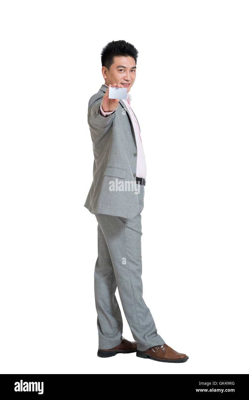 Studio shot business man show card Stock Photo - Alamy