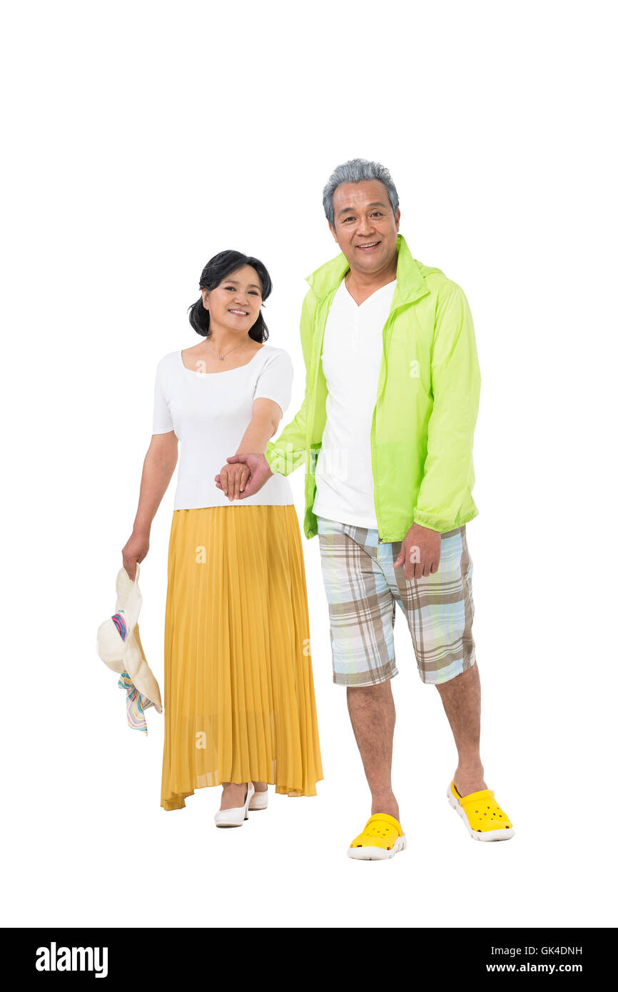 Elderly couple walking hand in hand Cut Out Stock Images & Pictures - Alamy