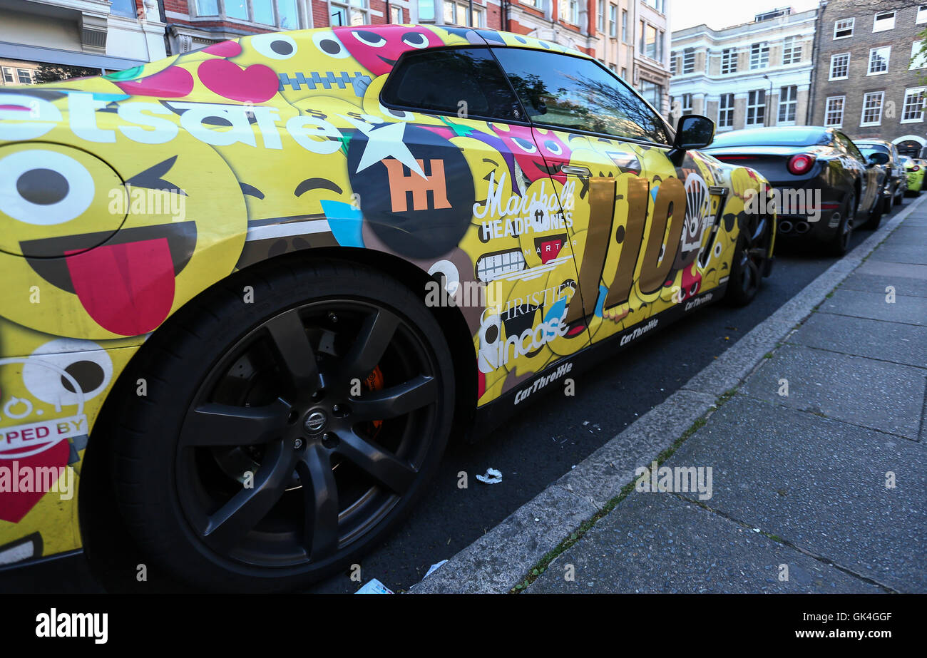 An emoji wrapped Nissan GT R competes in the 2016 Gumball 3000 in ...