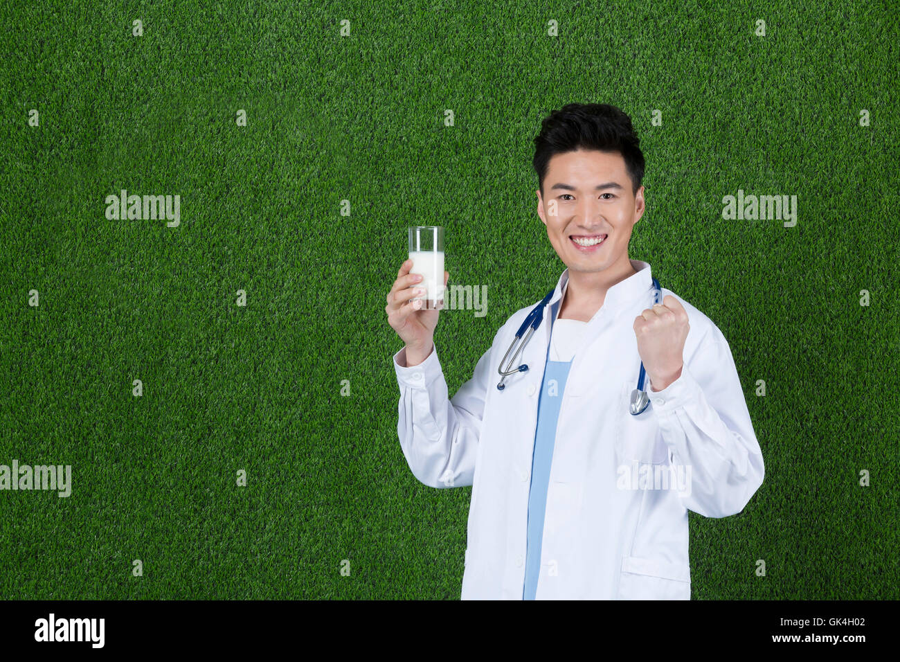 Meadow young male doctor holding milk Stock Photo - Alamy