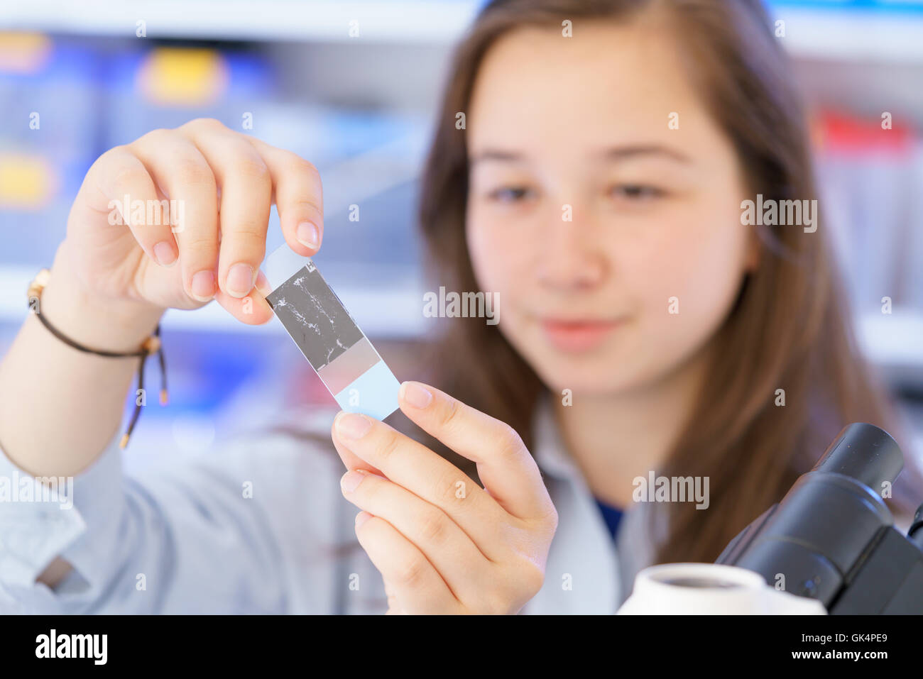 Female Teenage Student In Science Class With Experiment, Young Woman ...