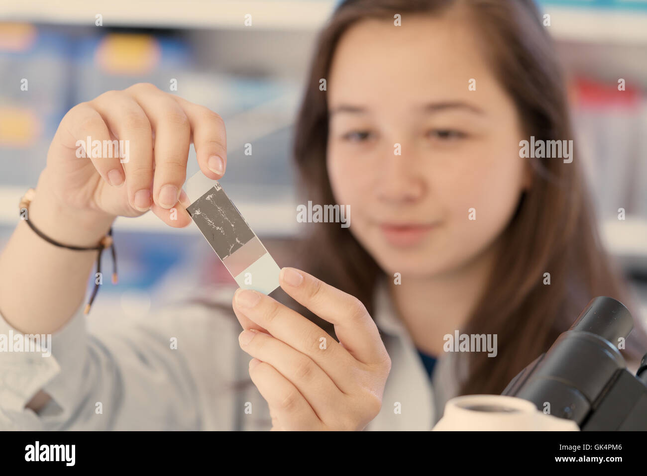 Female Teenage Student In Science Class With Experiment, Young Woman ...