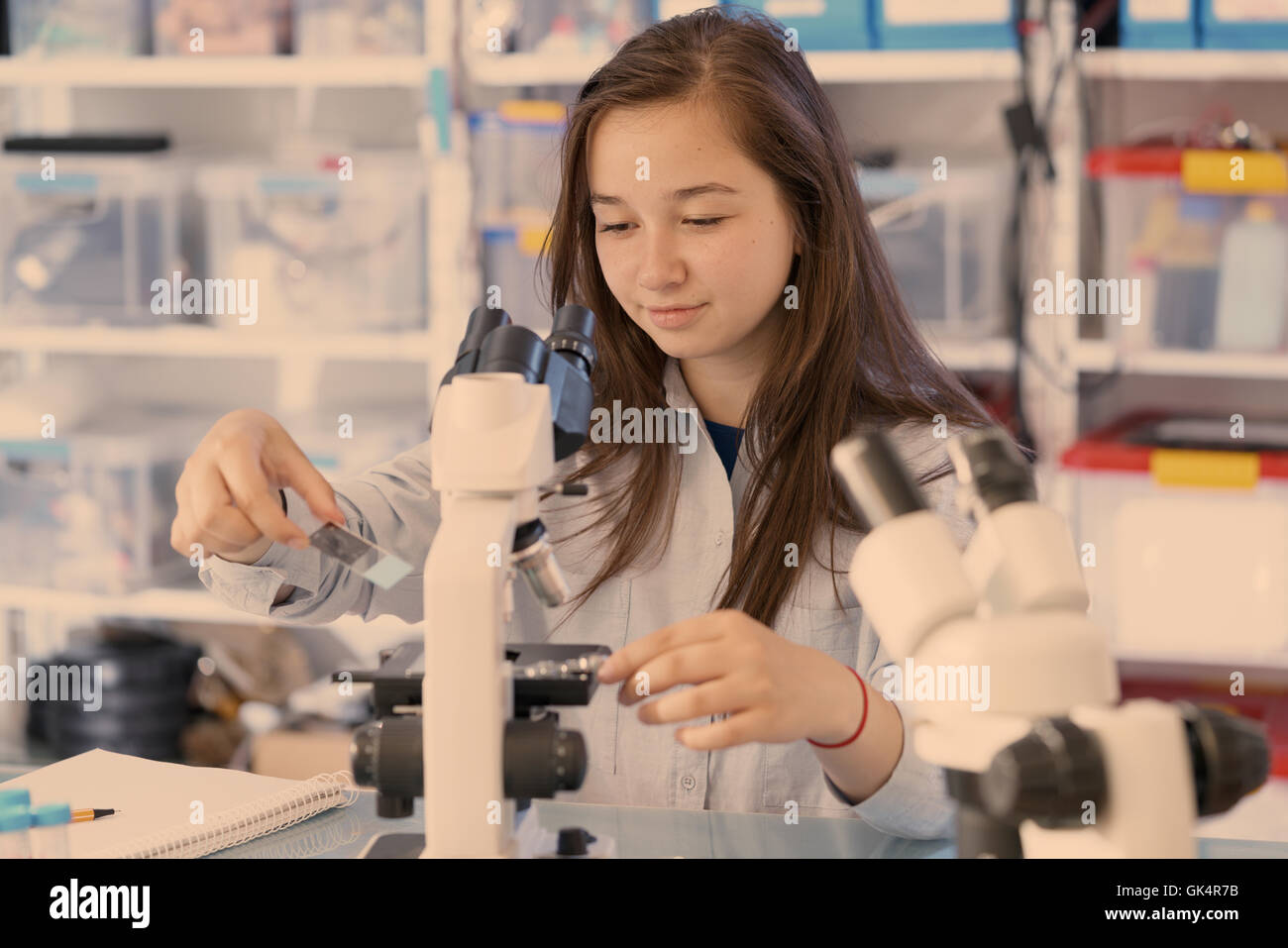 Female Teenage Student In Science Class With Experiment, Young Woman ...