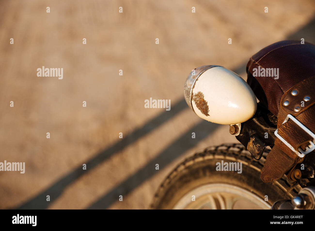 Close-up view on retro motorcycle headlights on the desert background ...