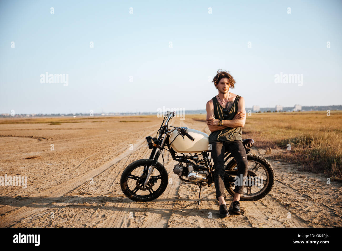 Man leaning on motorcycle hi-res stock photography and images - Alamy