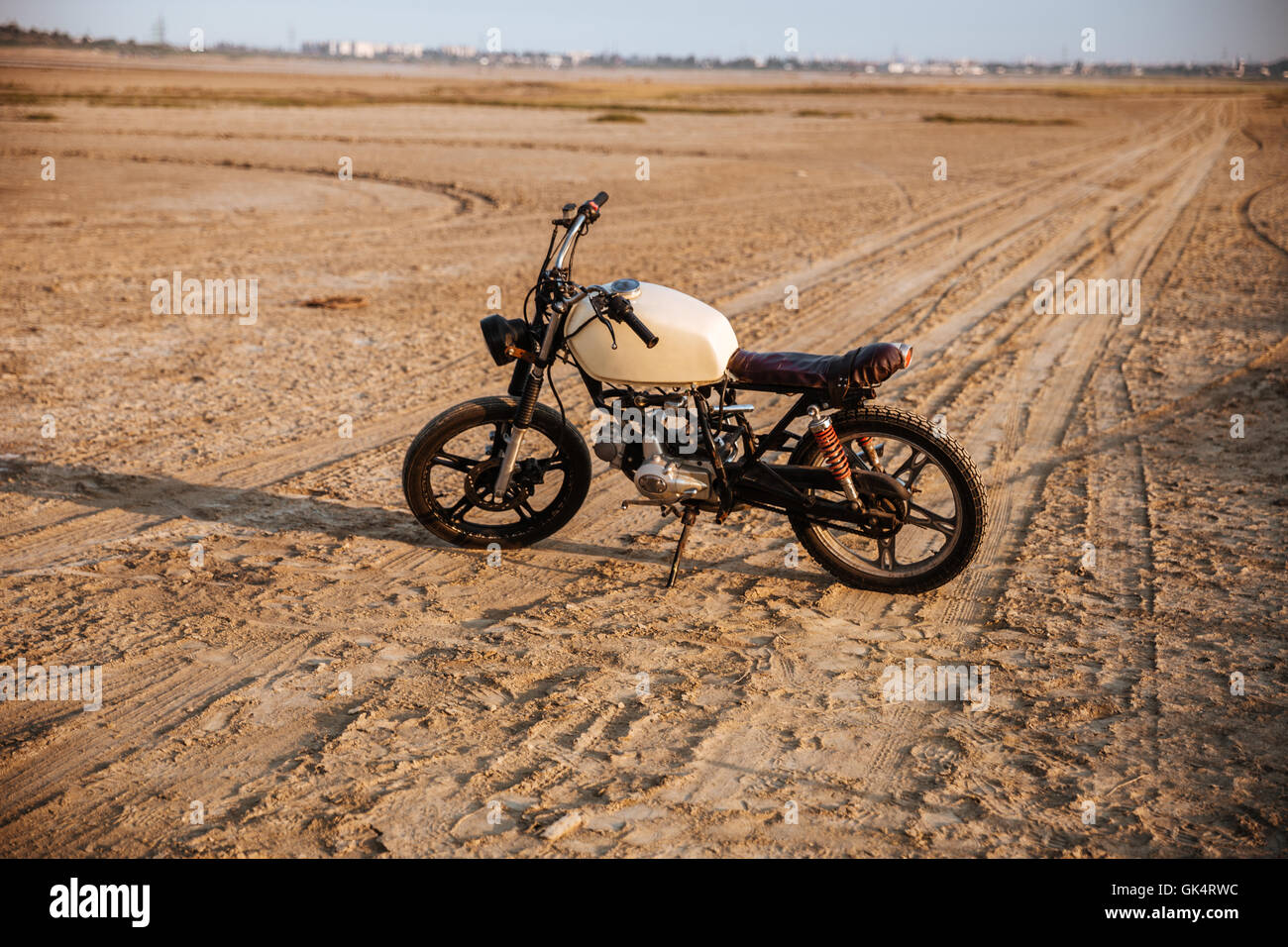 Retro motorcycle standing in the desert Stock Photo - Alamy