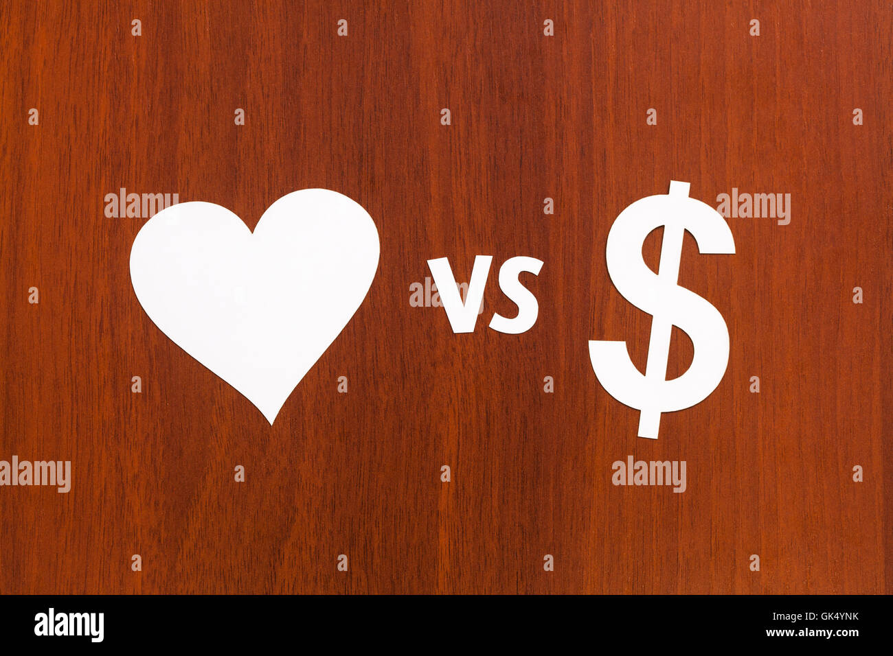 Love vs money, paper signs. Abstract conceptual image Stock Photo - Alamy