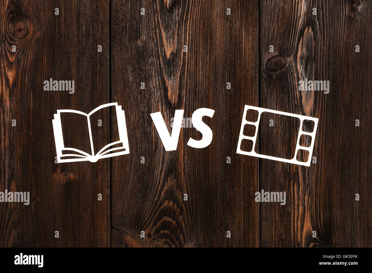 Reading books vs movie. Abstract paper conceptual image Stock Photo - Alamy