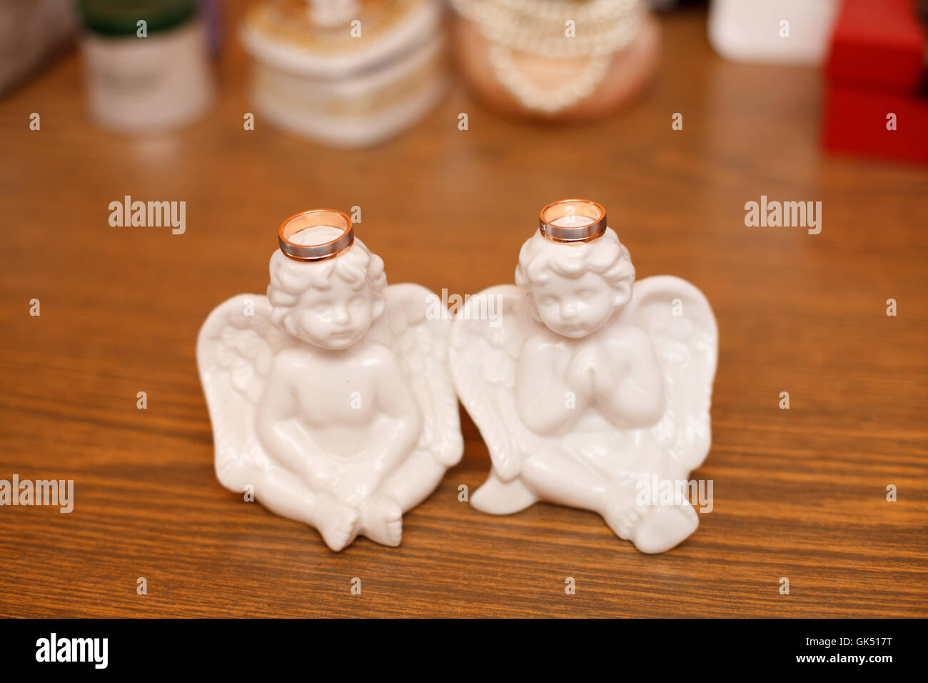 Two angels with golden rings. Romantic composition for wedding day ...