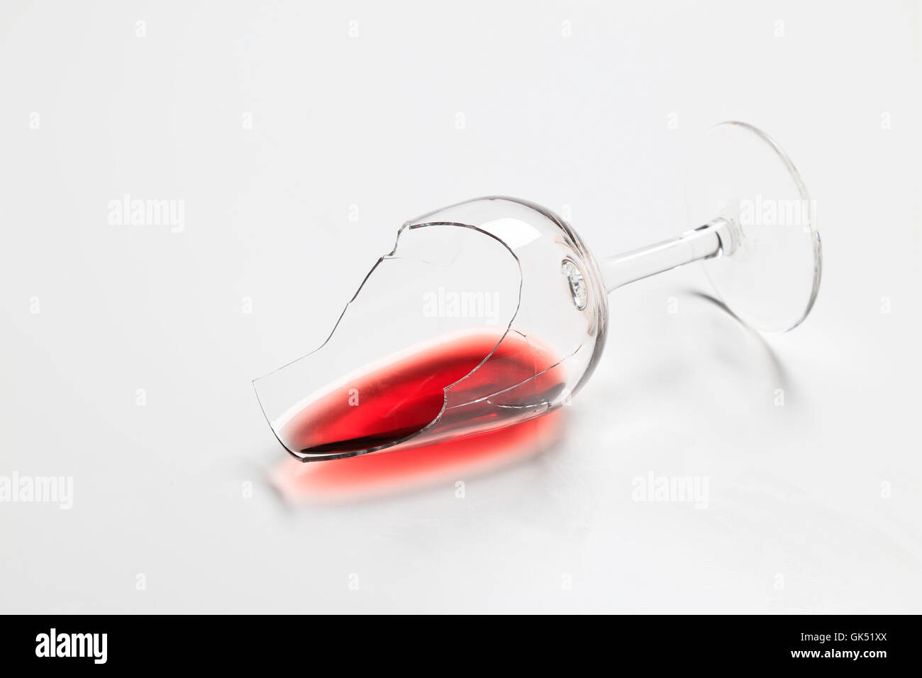 Broken Red Wine tasting glass with wine Stock Photo - Alamy