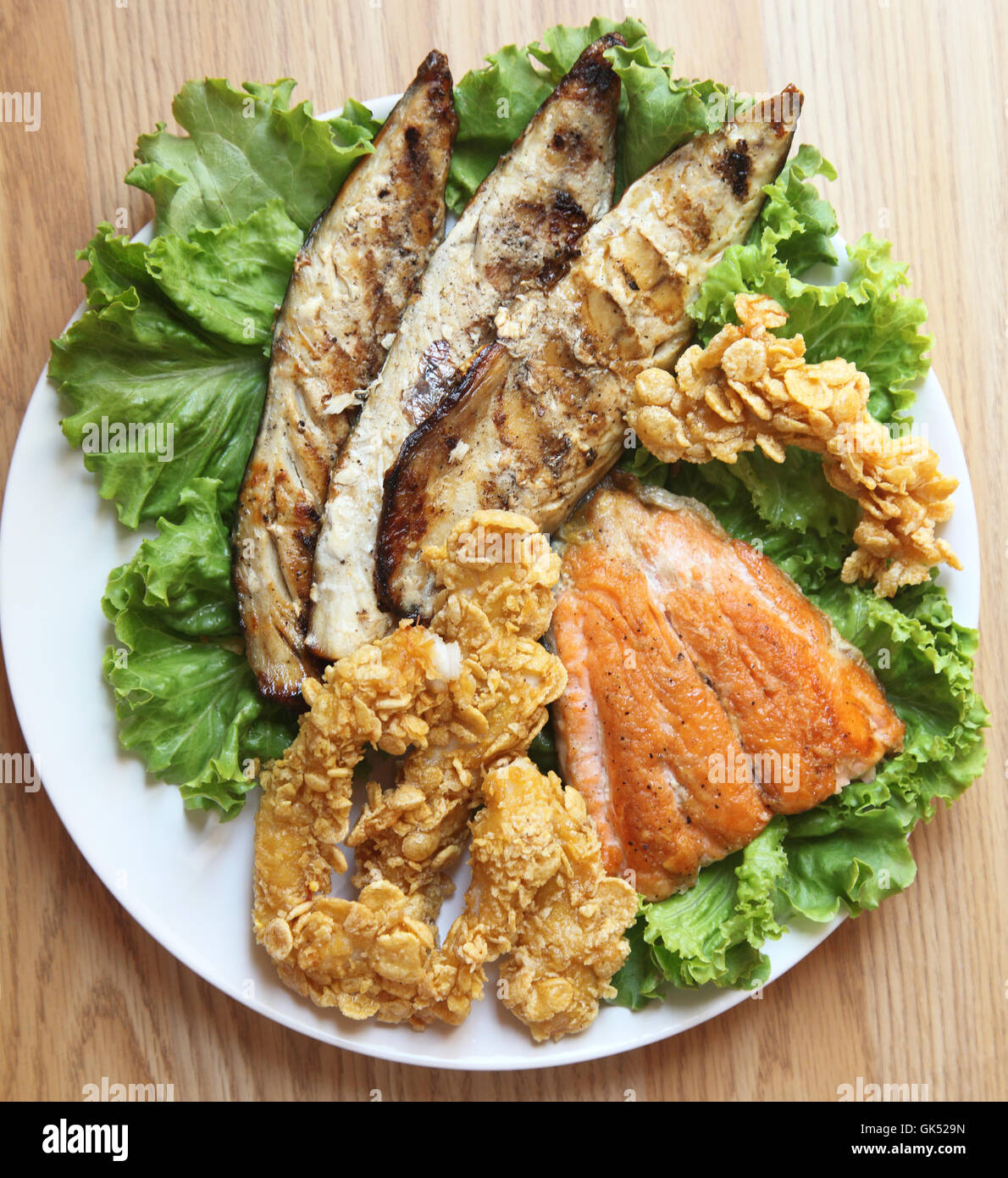 pieces of fried fish on a plate Stock Photo - Alamy