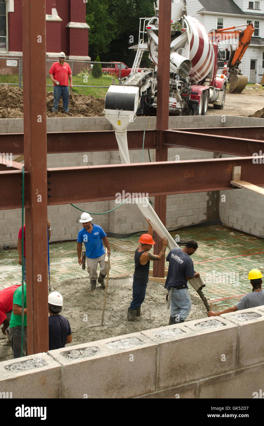 Men pouring cement Stock Photo - Alamy