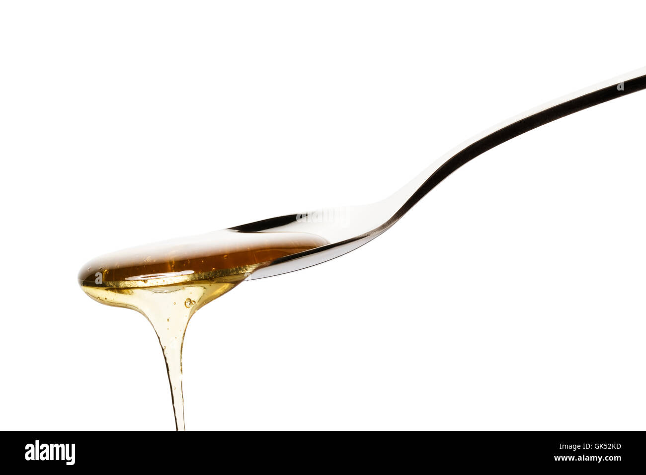honey running from a spoon Stock Photo - Alamy