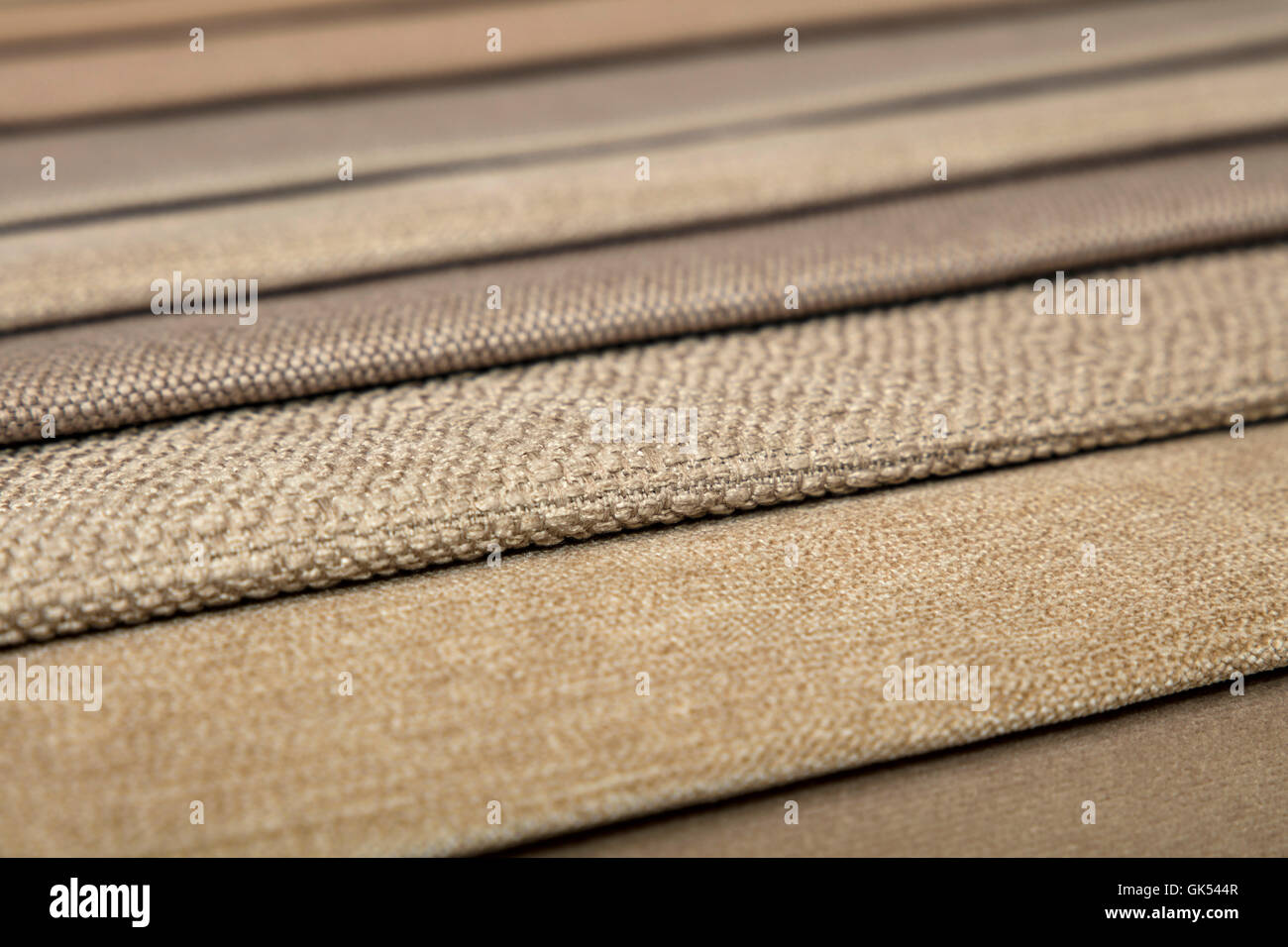 Colorful beige fabric samples swatch in textile catalogue palette ...