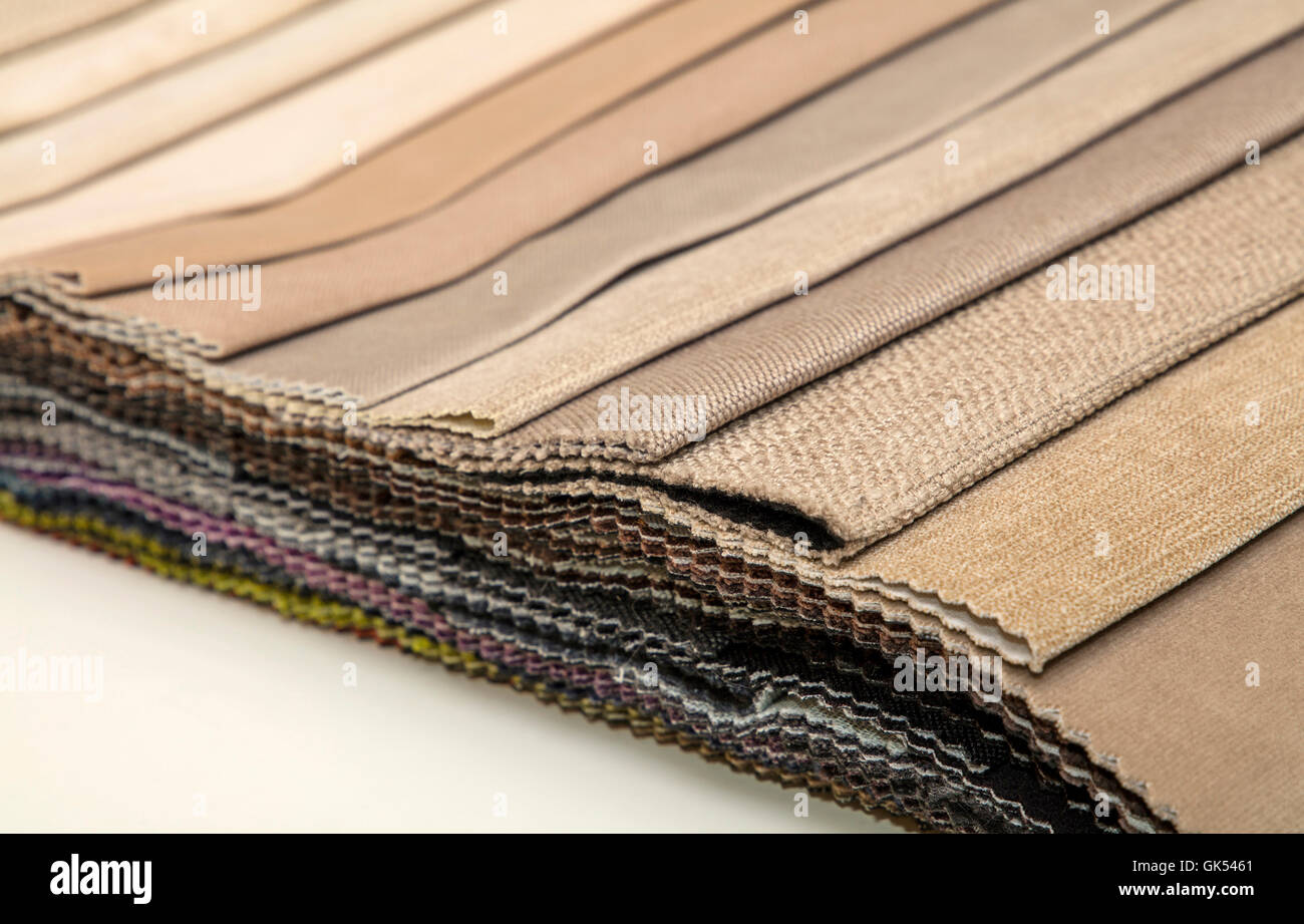 Colorful beige fabric samples swatch in textile catalogue palette ...