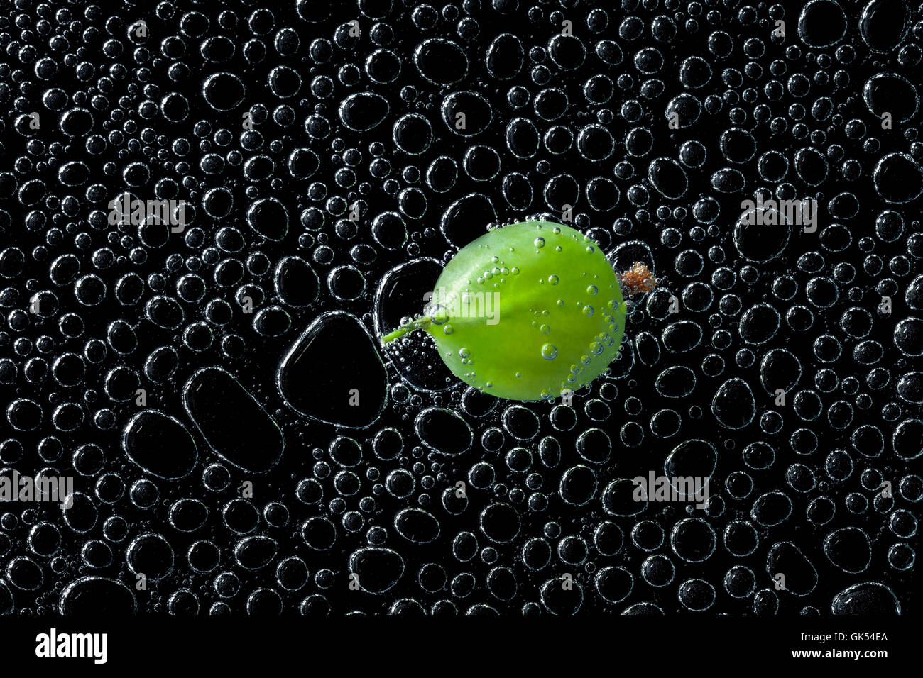 Gooseberries fruit in mineral water, a series of photos. Close-up ...