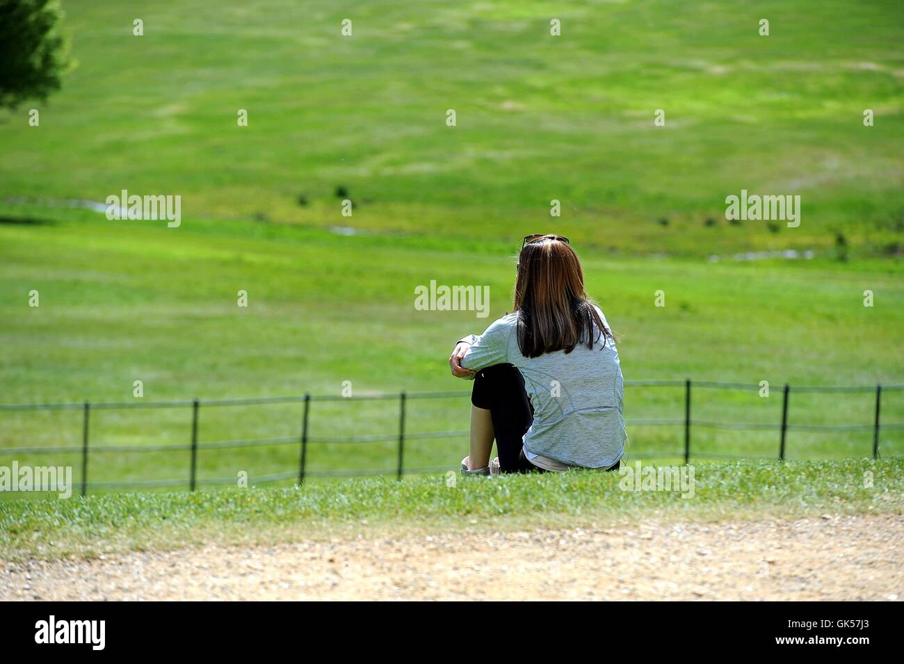 People enjoying the warm spring sunshine on Hampstead Heath Featuring ...