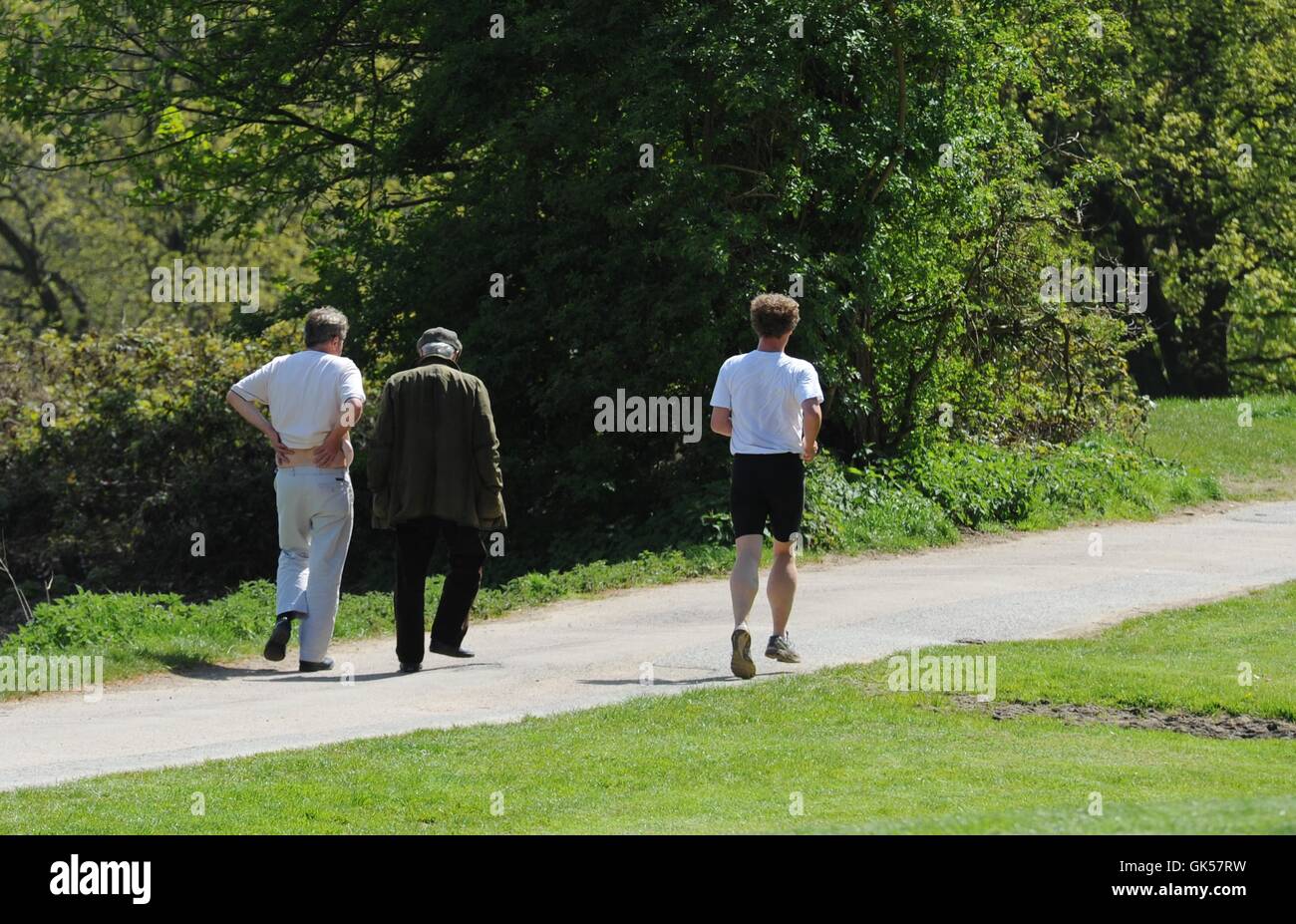 People enjoying the warm spring sunshine on Hampstead Heath Featuring ...