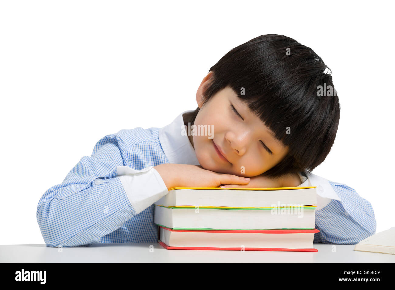 Little boy lying on the desk to sleep Stock Photo - Alamy