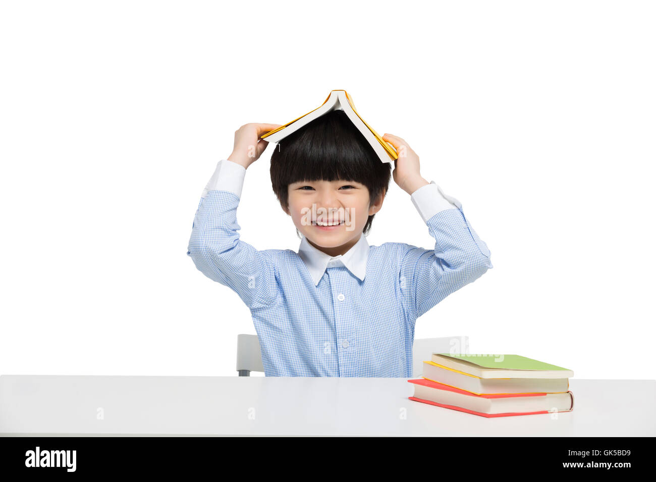 Little boy playing at the desk Stock Photo - Alamy